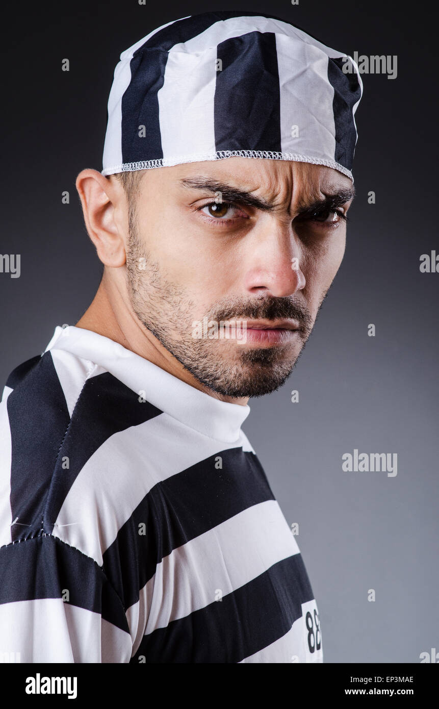 Convict criminal in striped uniform Stock Photo - Alamy