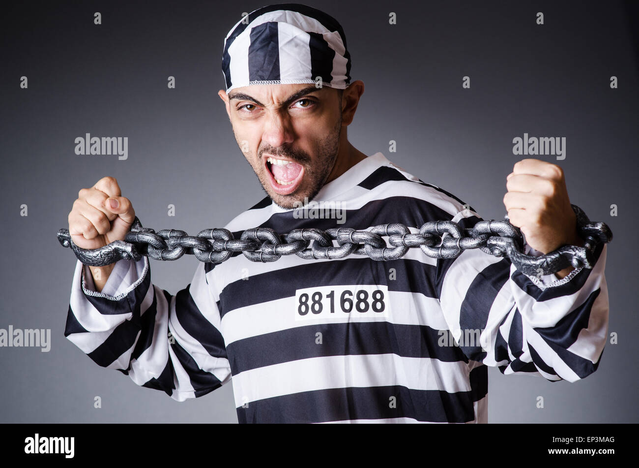 Convict criminal in striped uniform Stock Photo - Alamy
