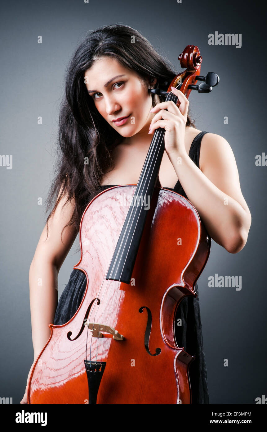 Woman cellist performing with cello Stock Photo - Alamy
