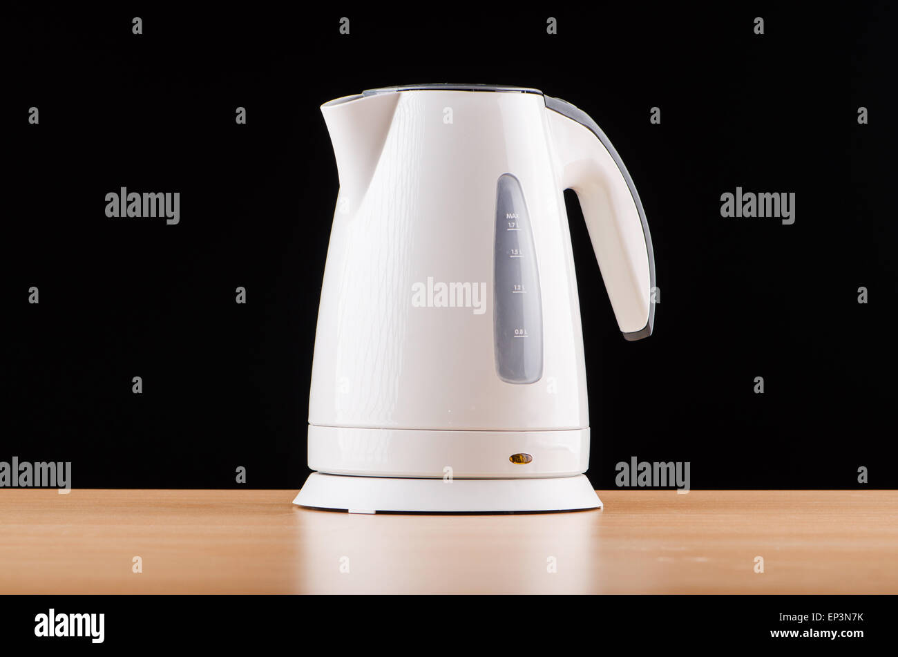 White kettle against grey background Stock Photo - Alamy