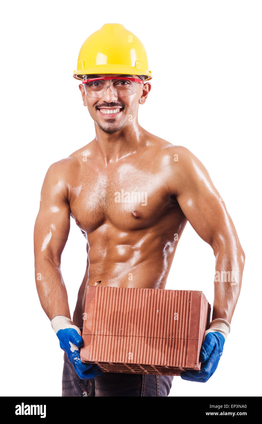 Muscular builder with bricks on white Stock Photo - Alamy