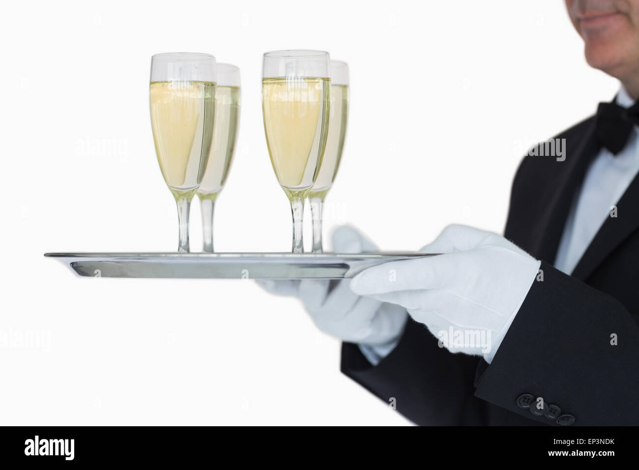 Waiter carrying tray full glasses of champagne Stock Photo - Alamy