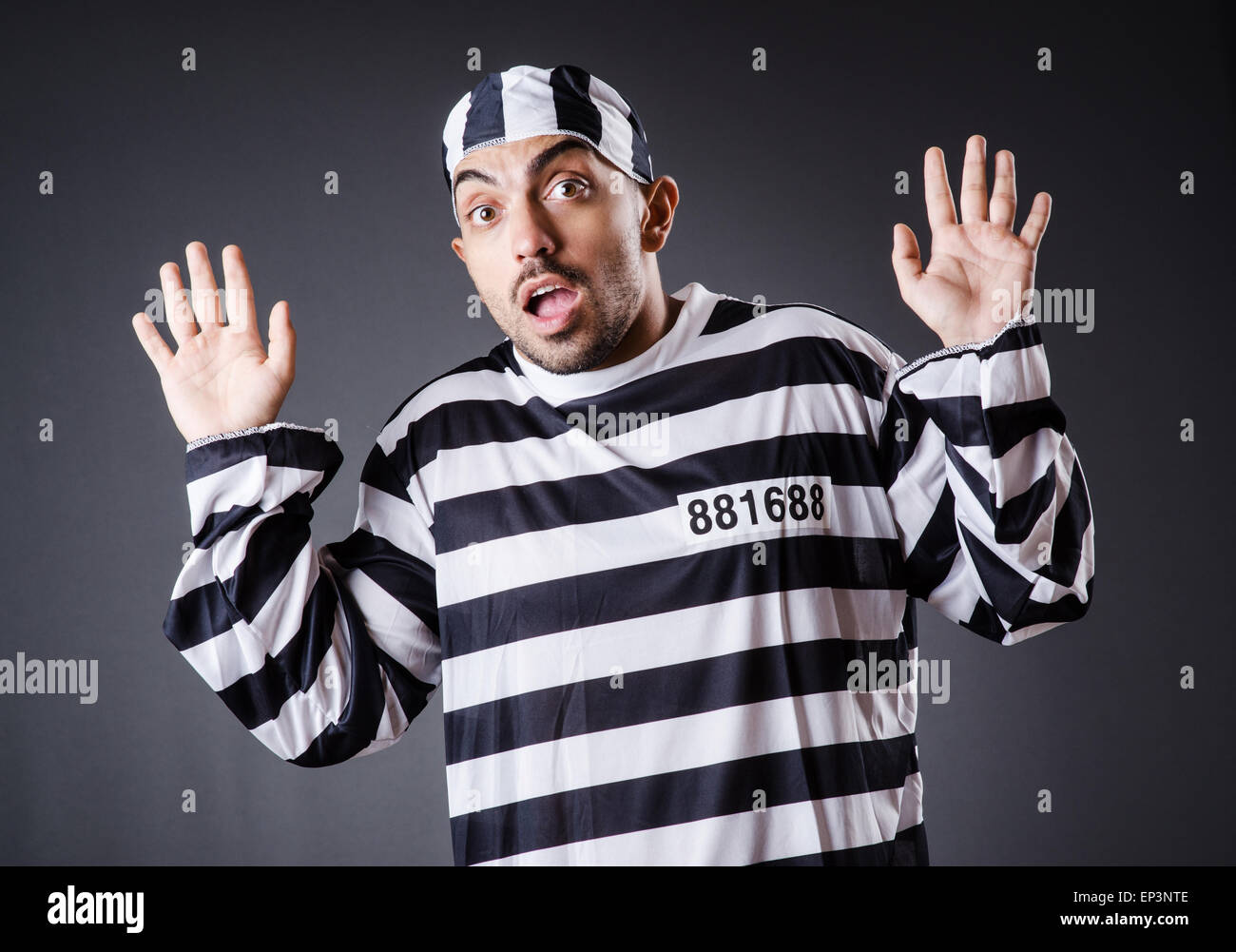 Convict criminal in striped uniform Stock Photo - Alamy