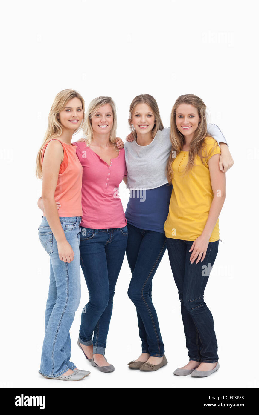 Full length of four girls standing beside each other and smiling Stock ...