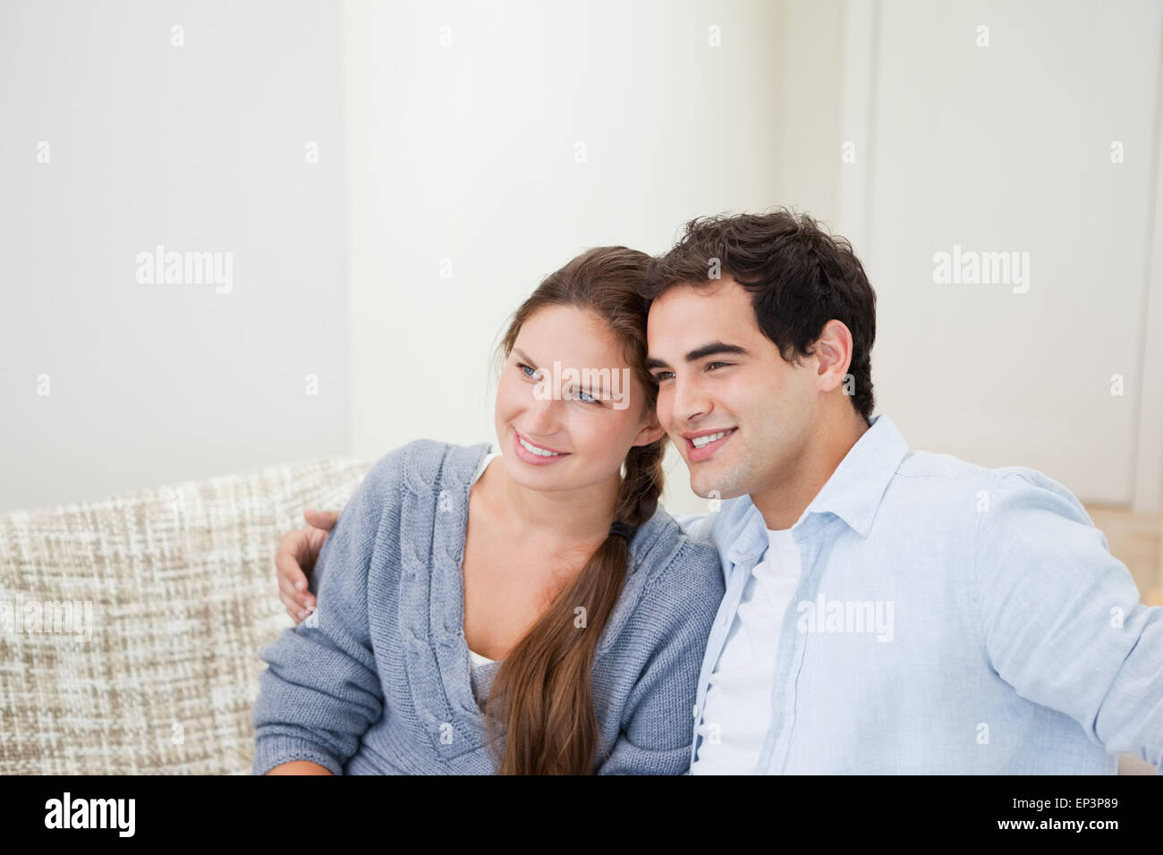 Couple smiling while hugging each other Stock Photo - Alamy