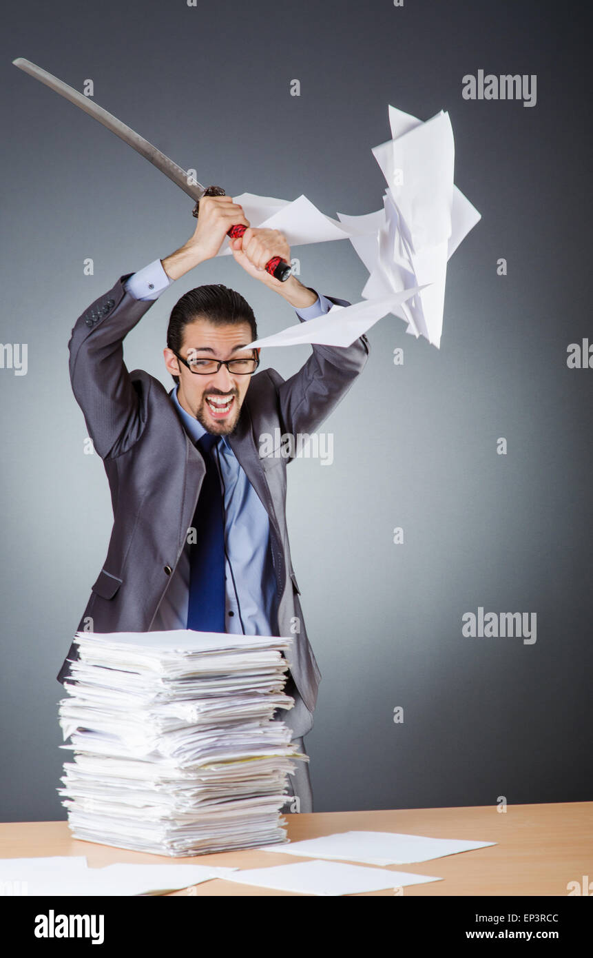 Businessman cutting the pile of paper Stock Photo - Alamy