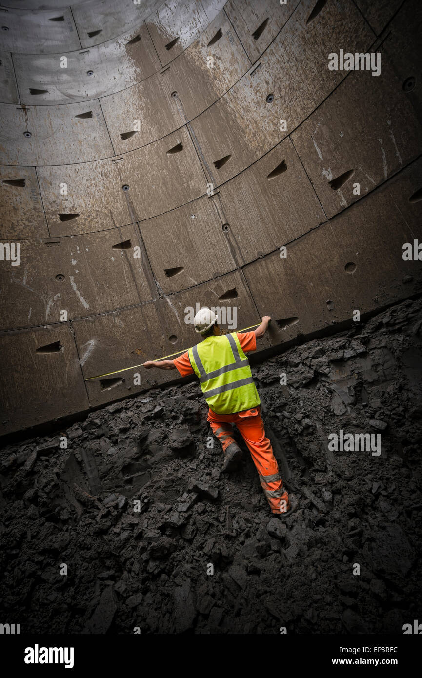 Construction worker working in a deep excavation Stock Photo - Alamy