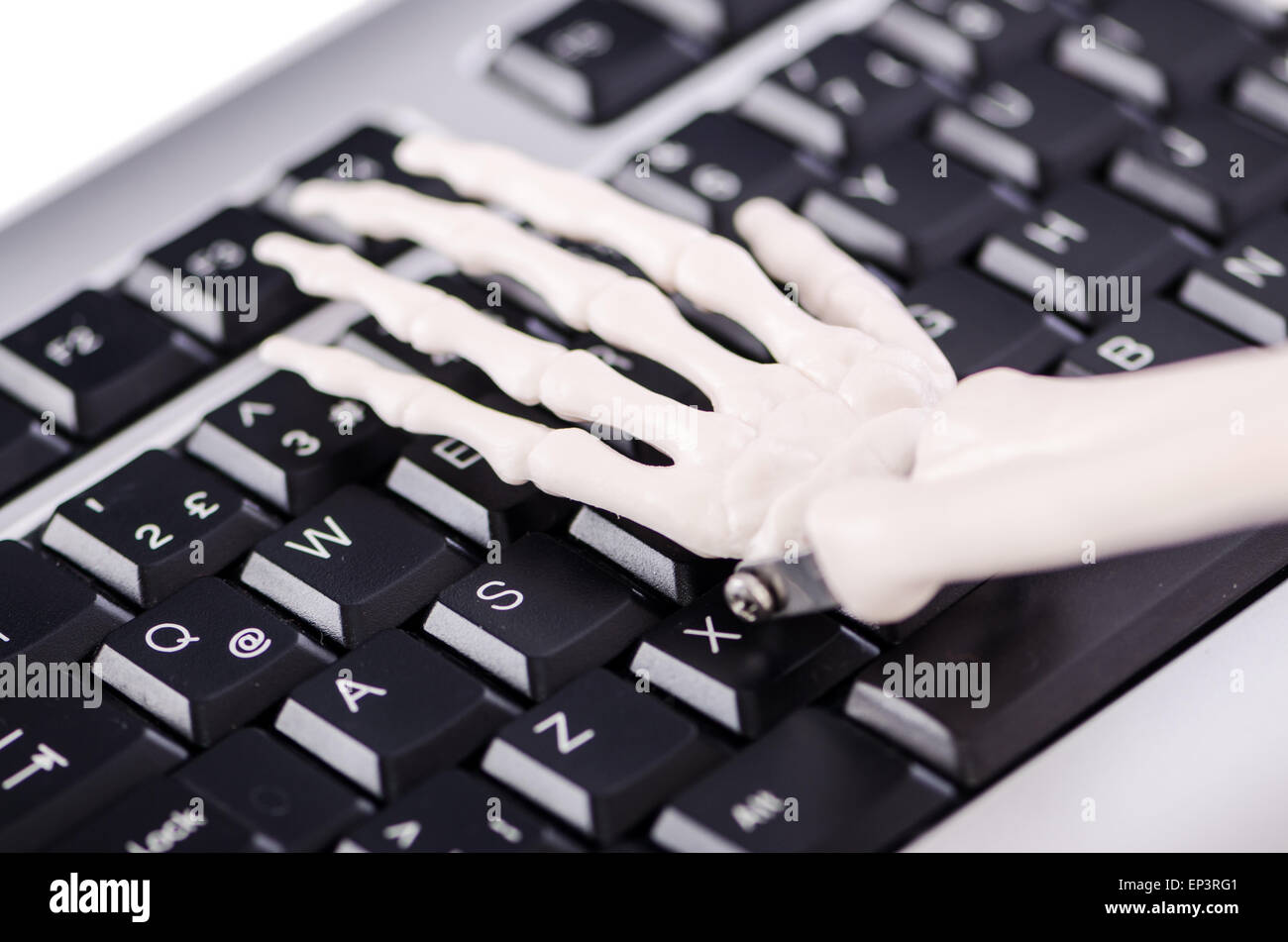 Skeleton working on the keyboard Stock Photo - Alamy