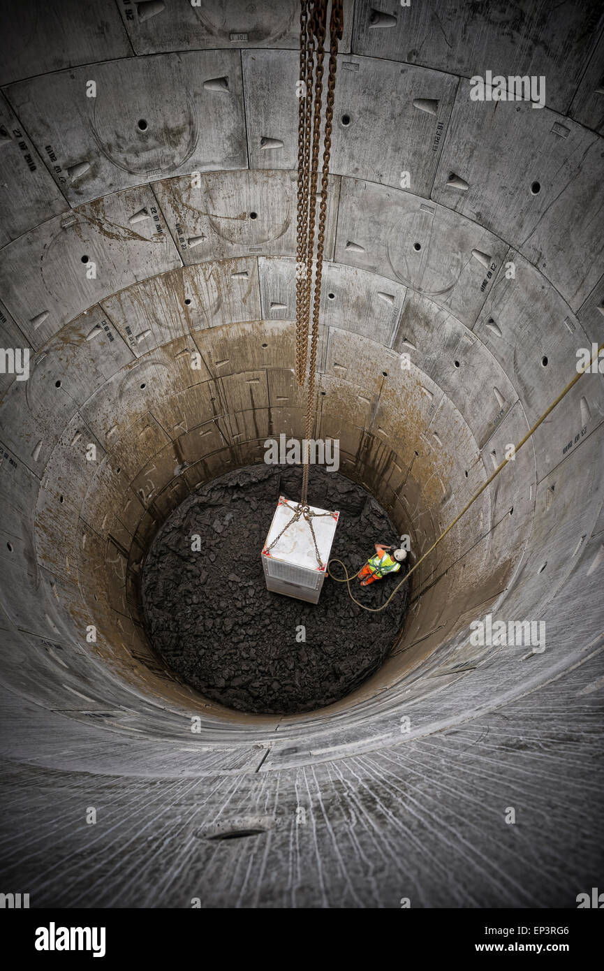 Working in a deep excavation on a construction site Stock Photo - Alamy