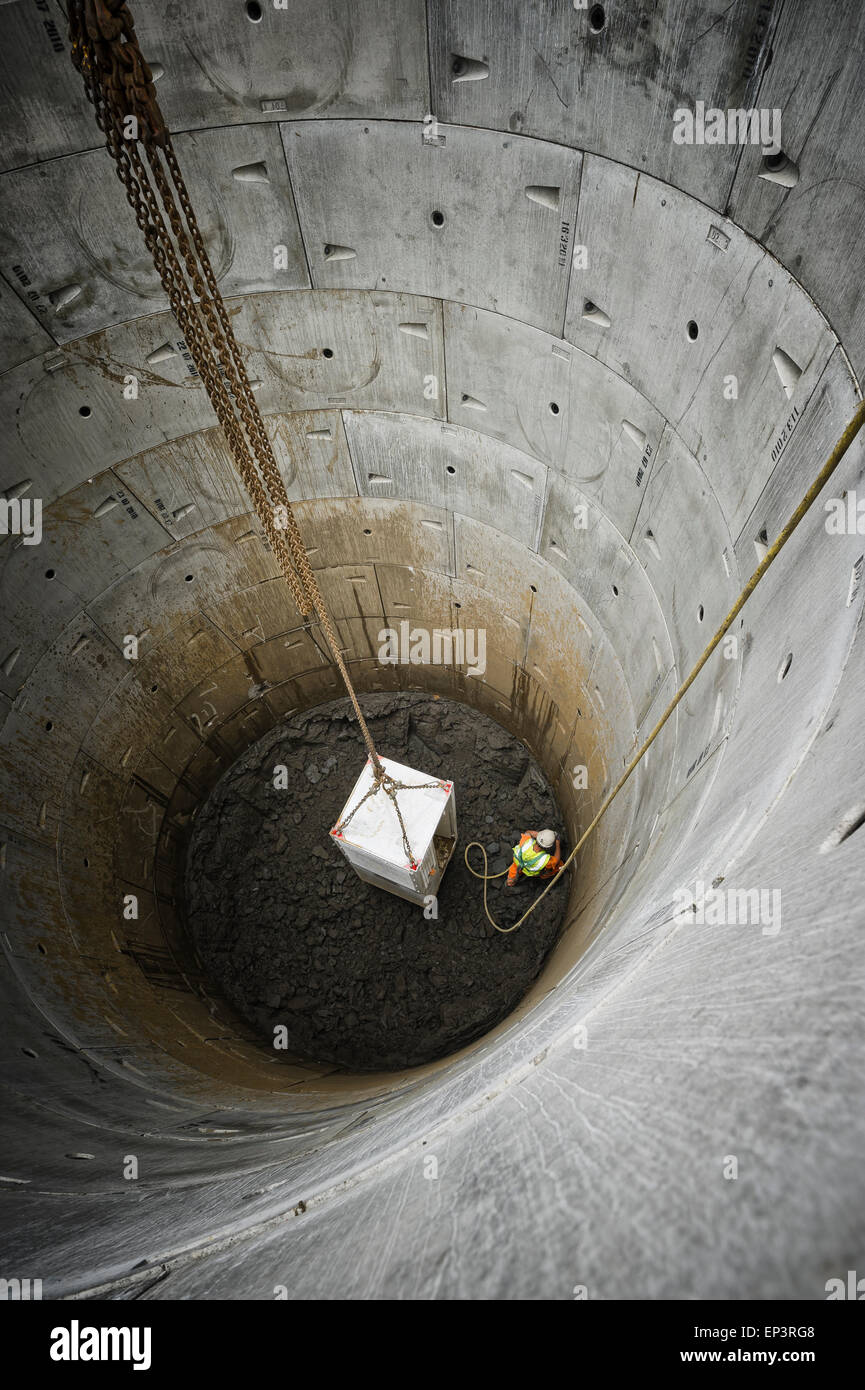 Working in a deep excavation on a construction site Stock Photo - Alamy
