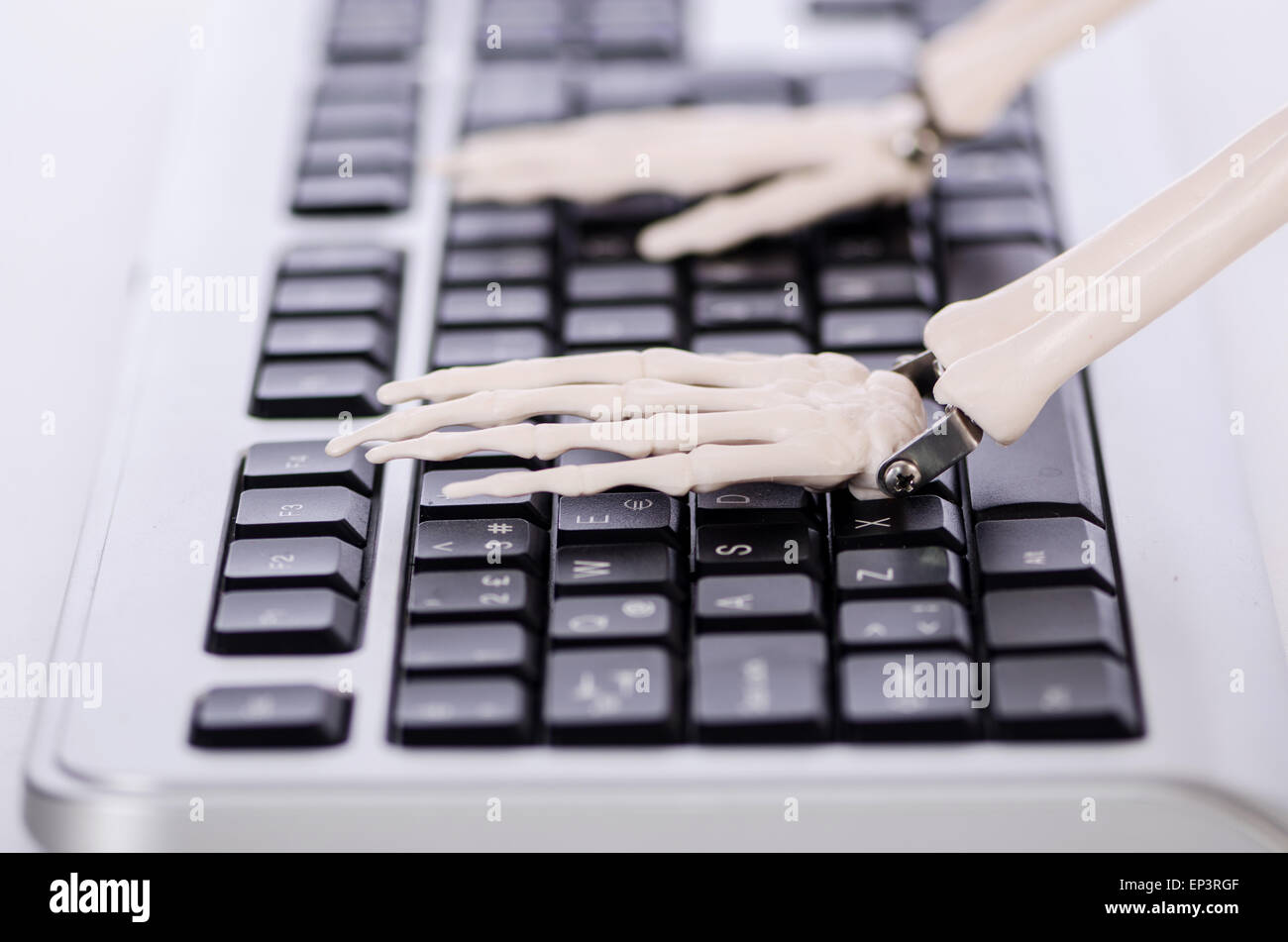 Skeleton working on the keyboard Stock Photo - Alamy