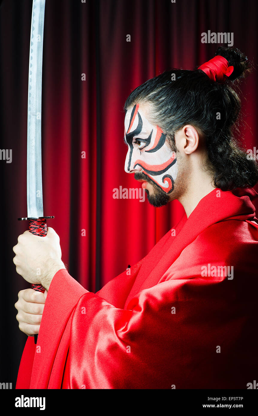 Man with sword and face mask Stock Photo - Alamy