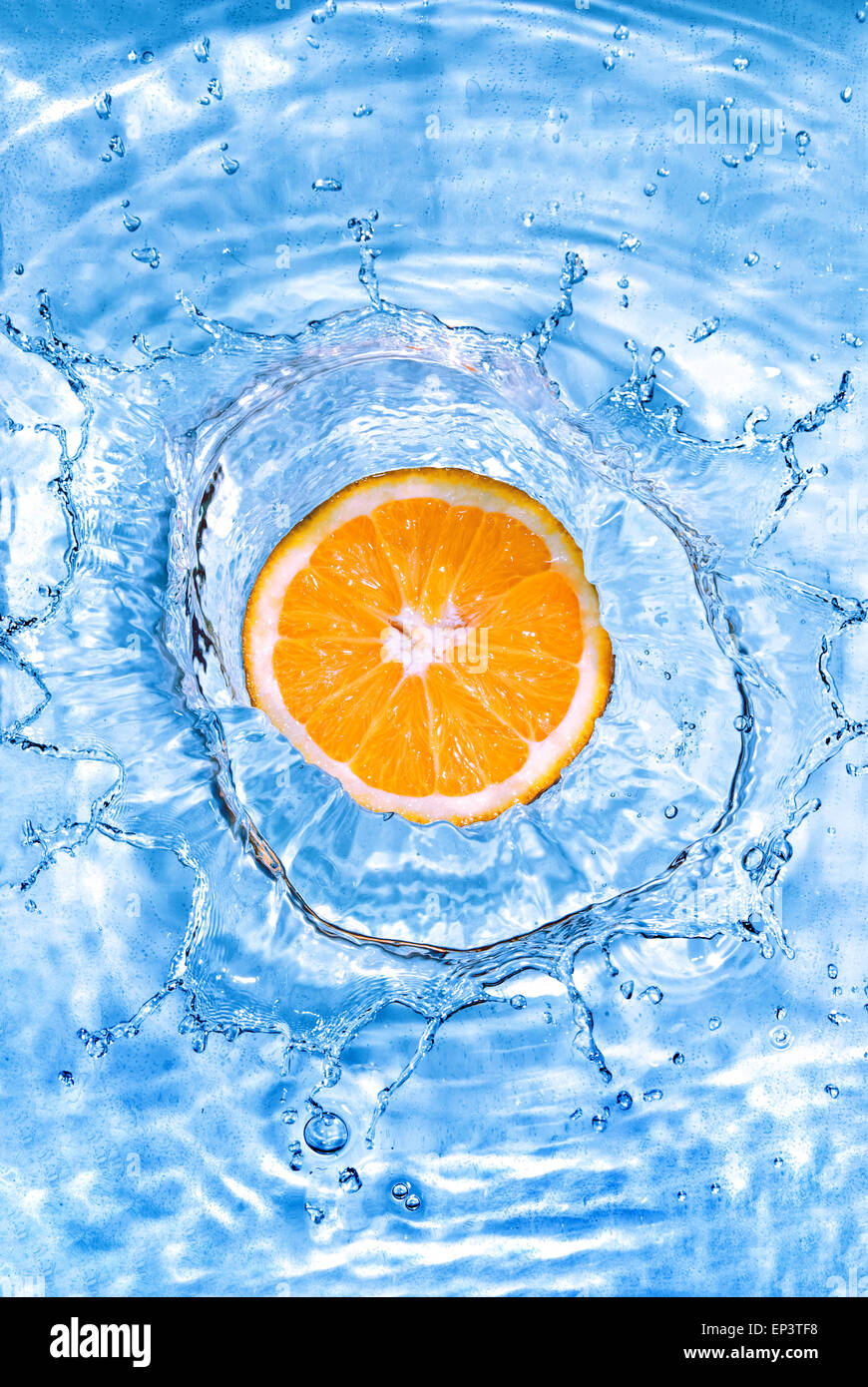 Fresh orange dropped into water with bubbles isolated on white Stock ...