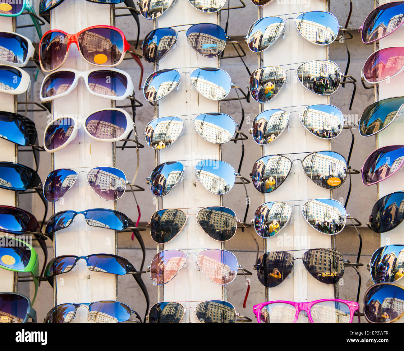 Many sunglasses on display in shop Stock Photo - Alamy
