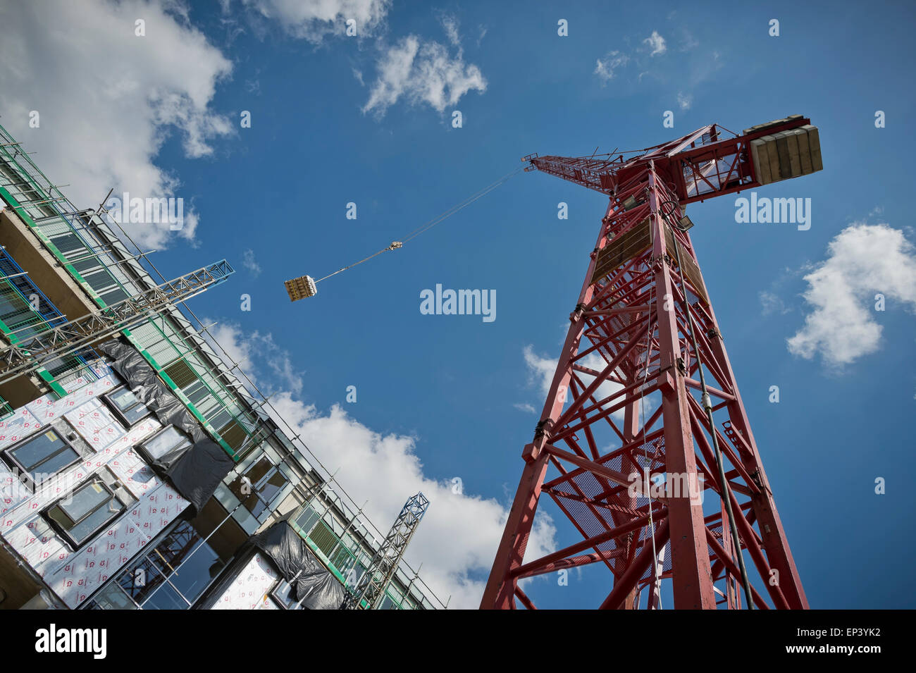 Tower crane lifting hi-res stock photography and images - Alamy