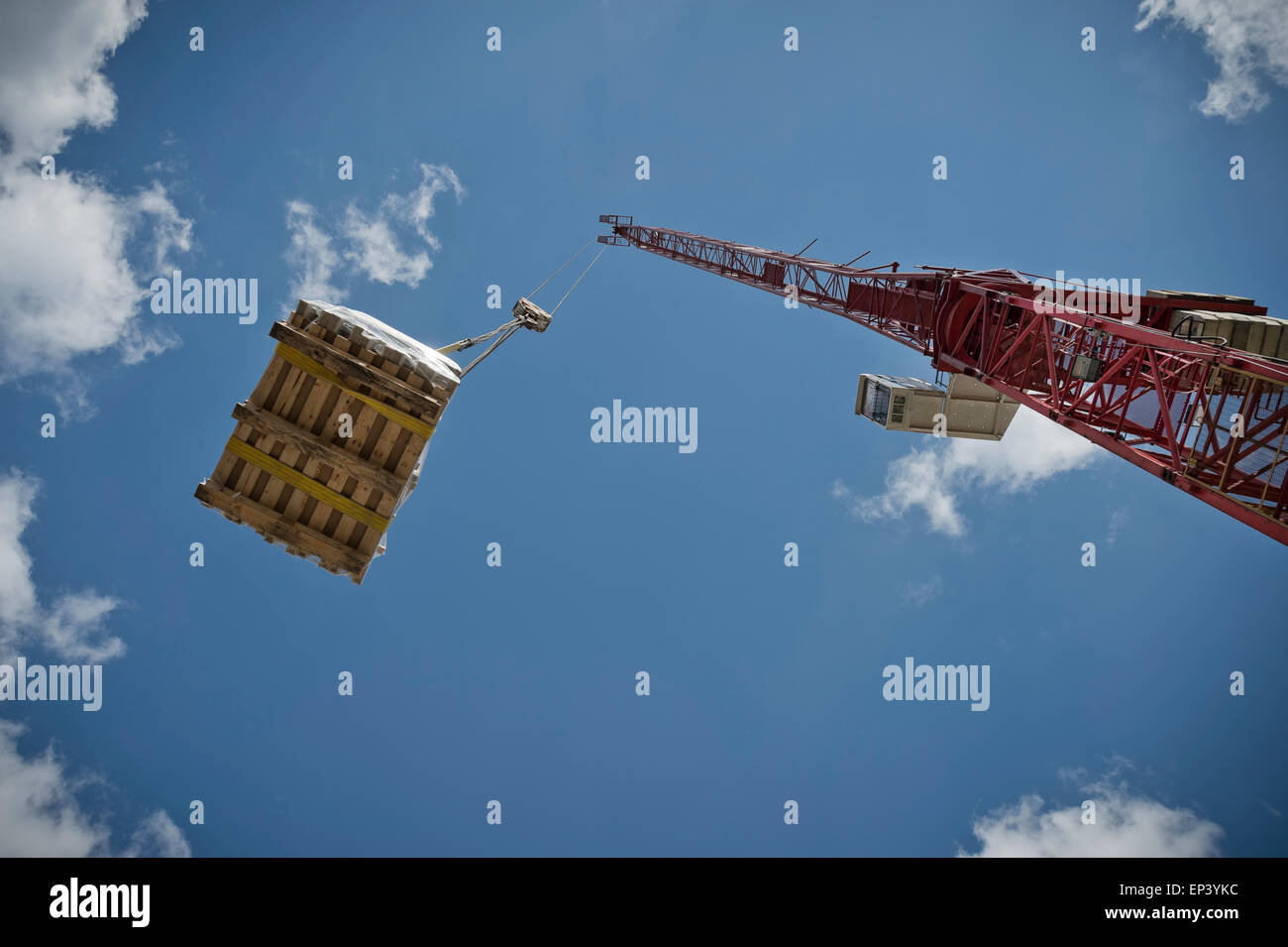 Tower crane lifting load on a construction site in London Stock Photo ...