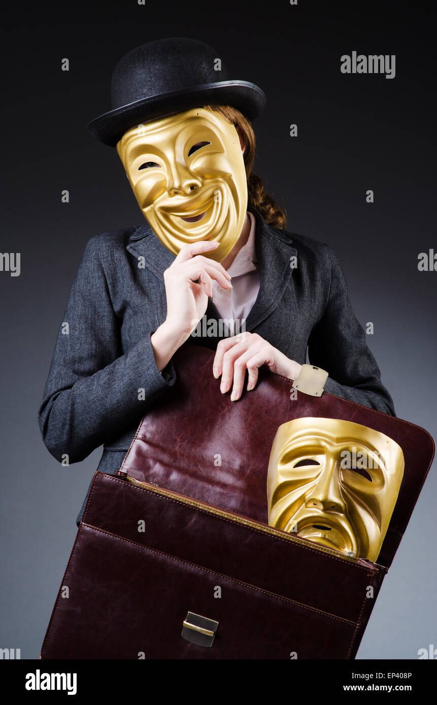 Woman with mask in hypocrisy concept Stock Photo - Alamy