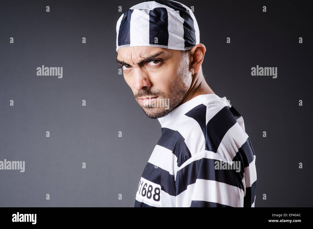 Convict criminal in striped uniform Stock Photo - Alamy