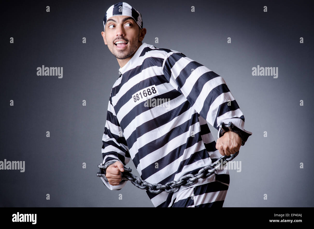 Convict criminal in striped uniform Stock Photo - Alamy