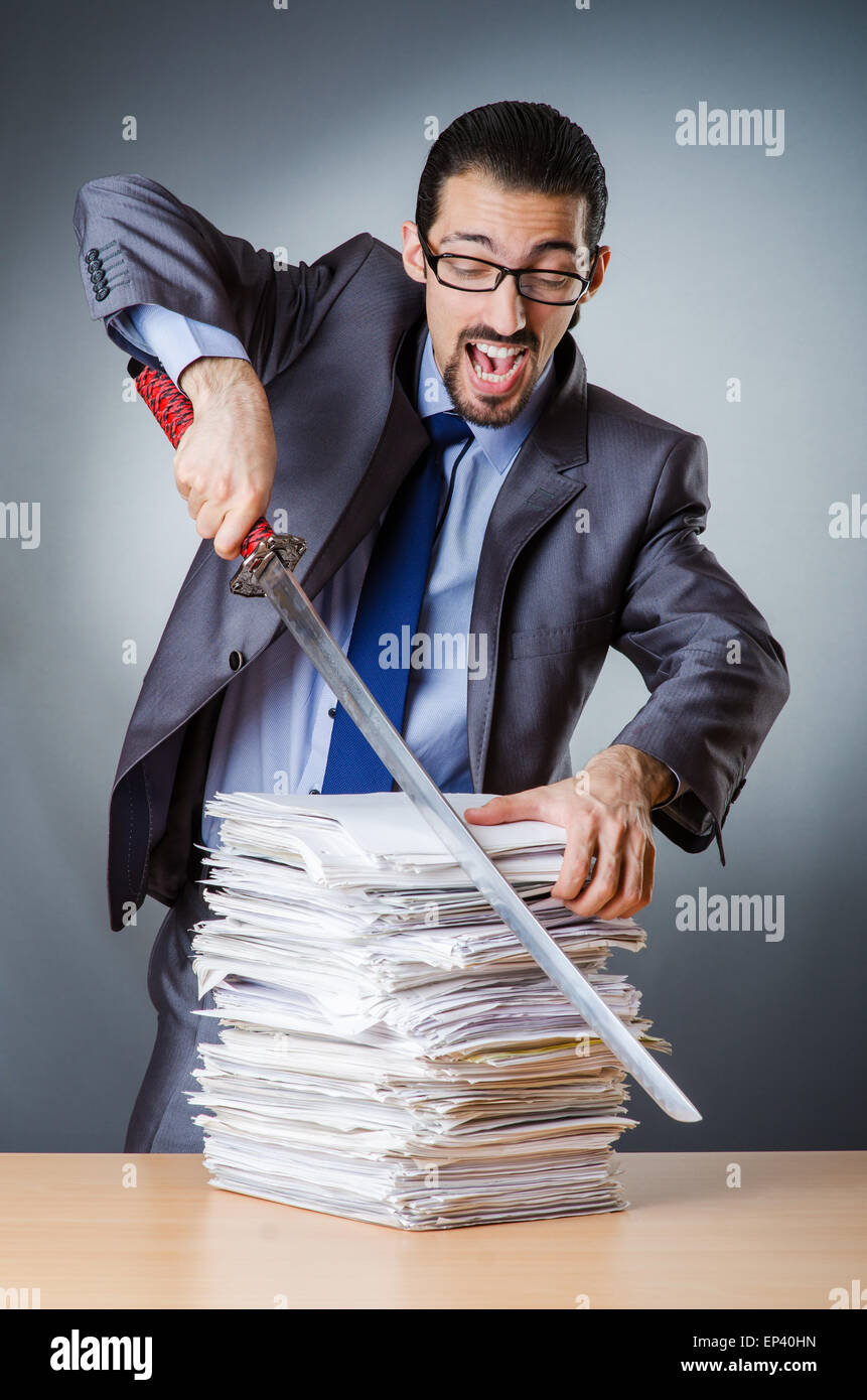 Businessman cutting the pile of paper Stock Photo - Alamy
