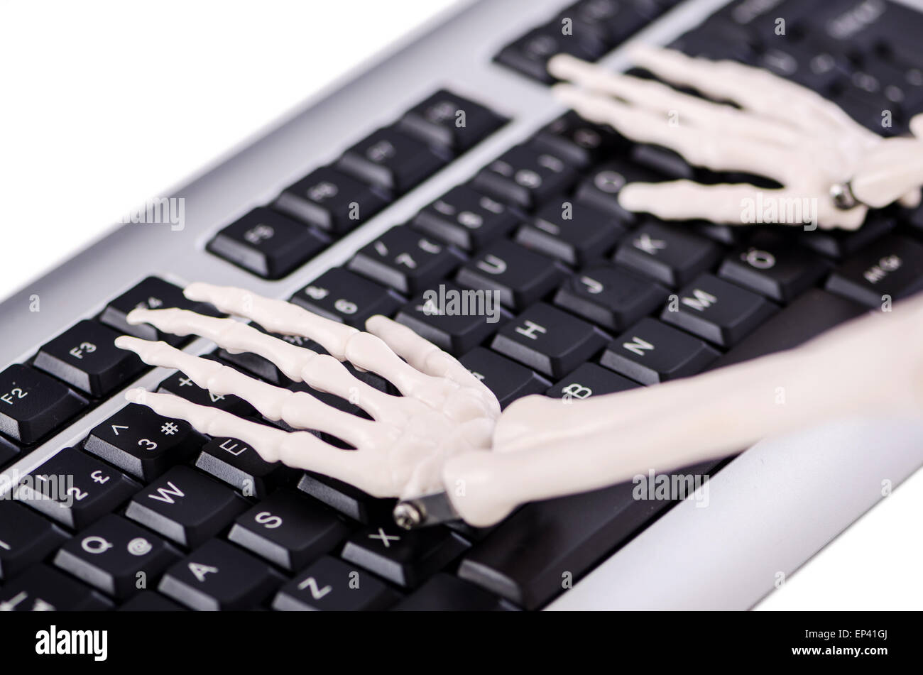 Skeleton working on the keyboard Stock Photo - Alamy