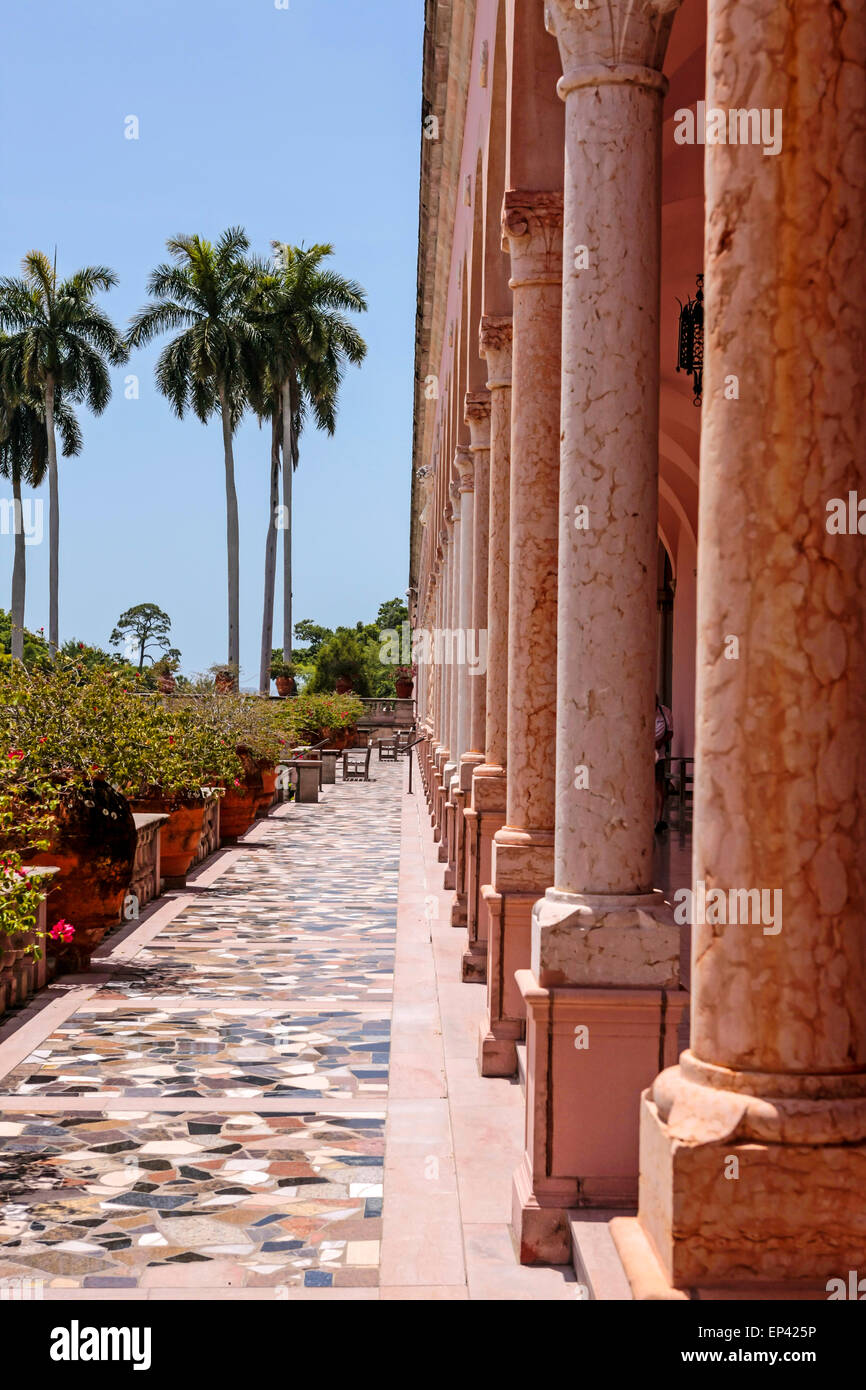 The formal gardens in the style of a Roman courtyard with columns and ...