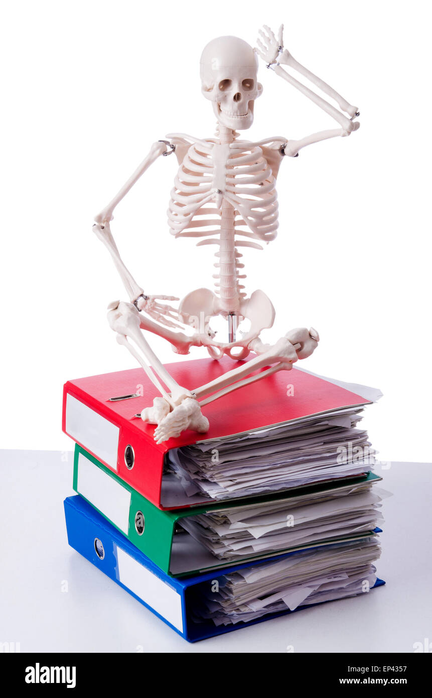 Skeleton with pile of files on white Stock Photo - Alamy
