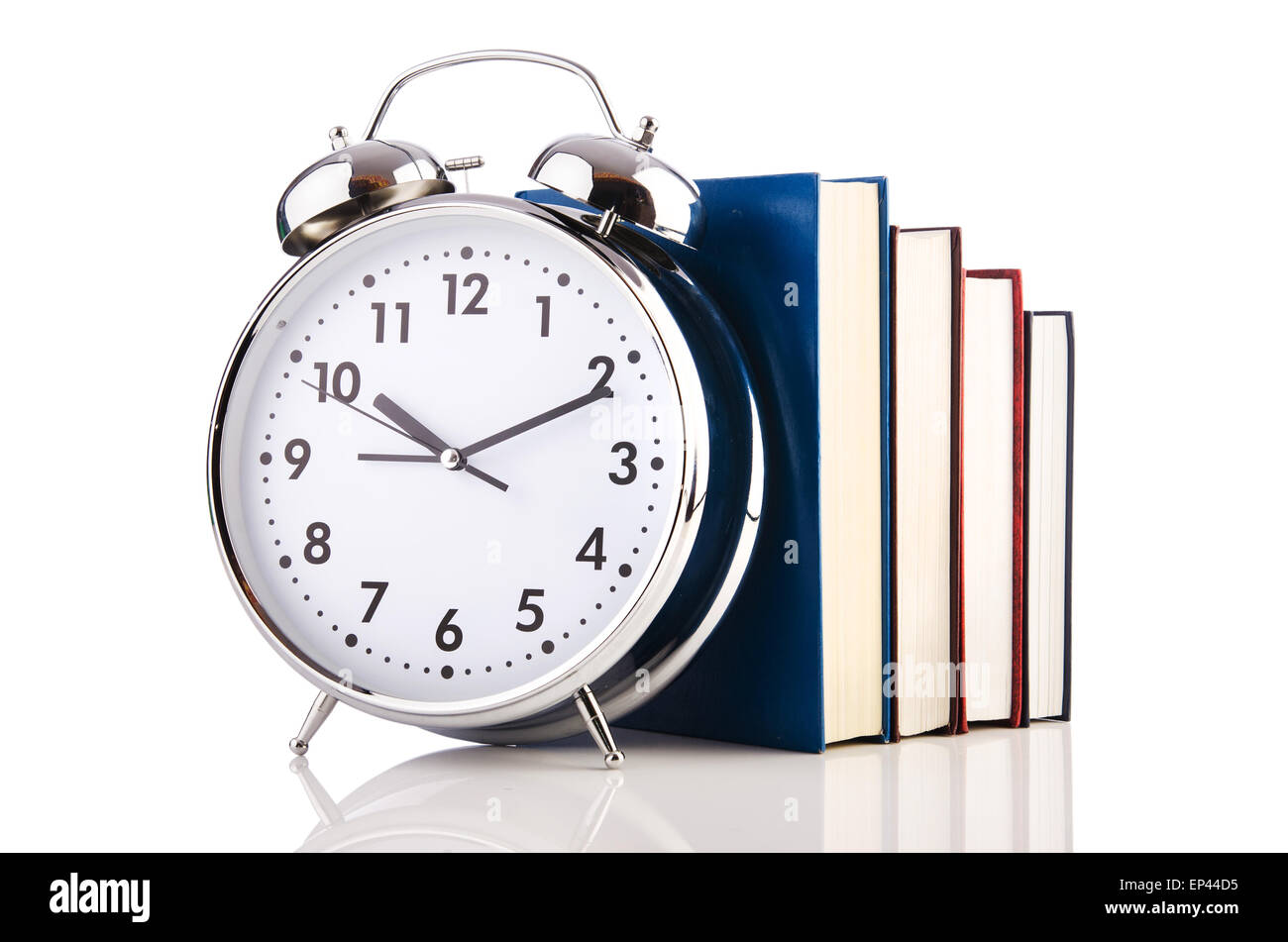 Alarm clock and books isolated on white Stock Photo - Alamy