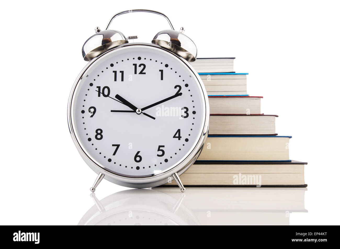 Alarm clock and books isolated on white Stock Photo - Alamy