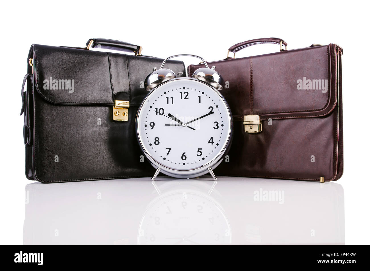 Alarm clock and briefcase isolated on white Stock Photo - Alamy