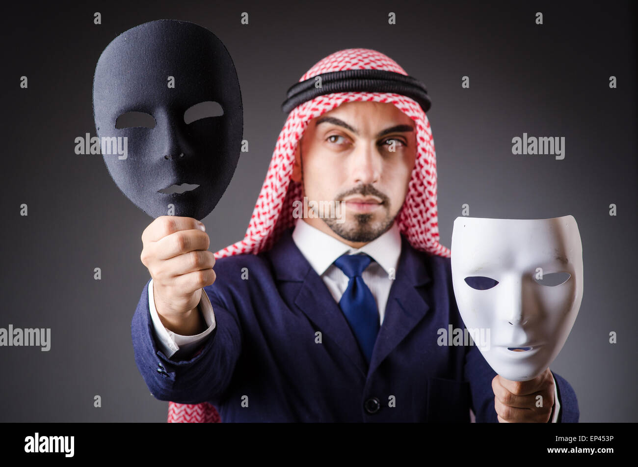 Arab with masks in dark studio Stock Photo - Alamy