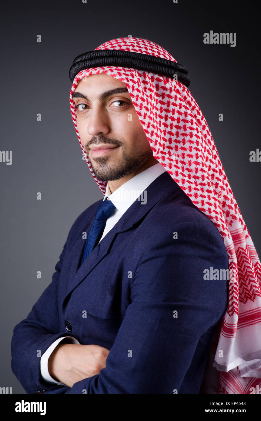Arab businessman in dark studio Stock Photo - Alamy