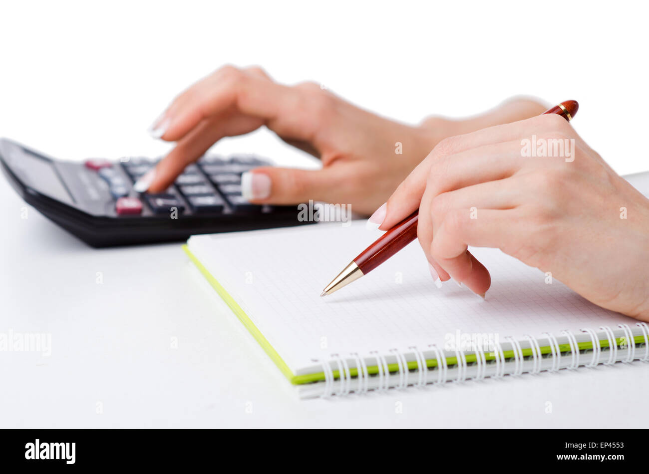 Hands working on the calculator Stock Photo - Alamy