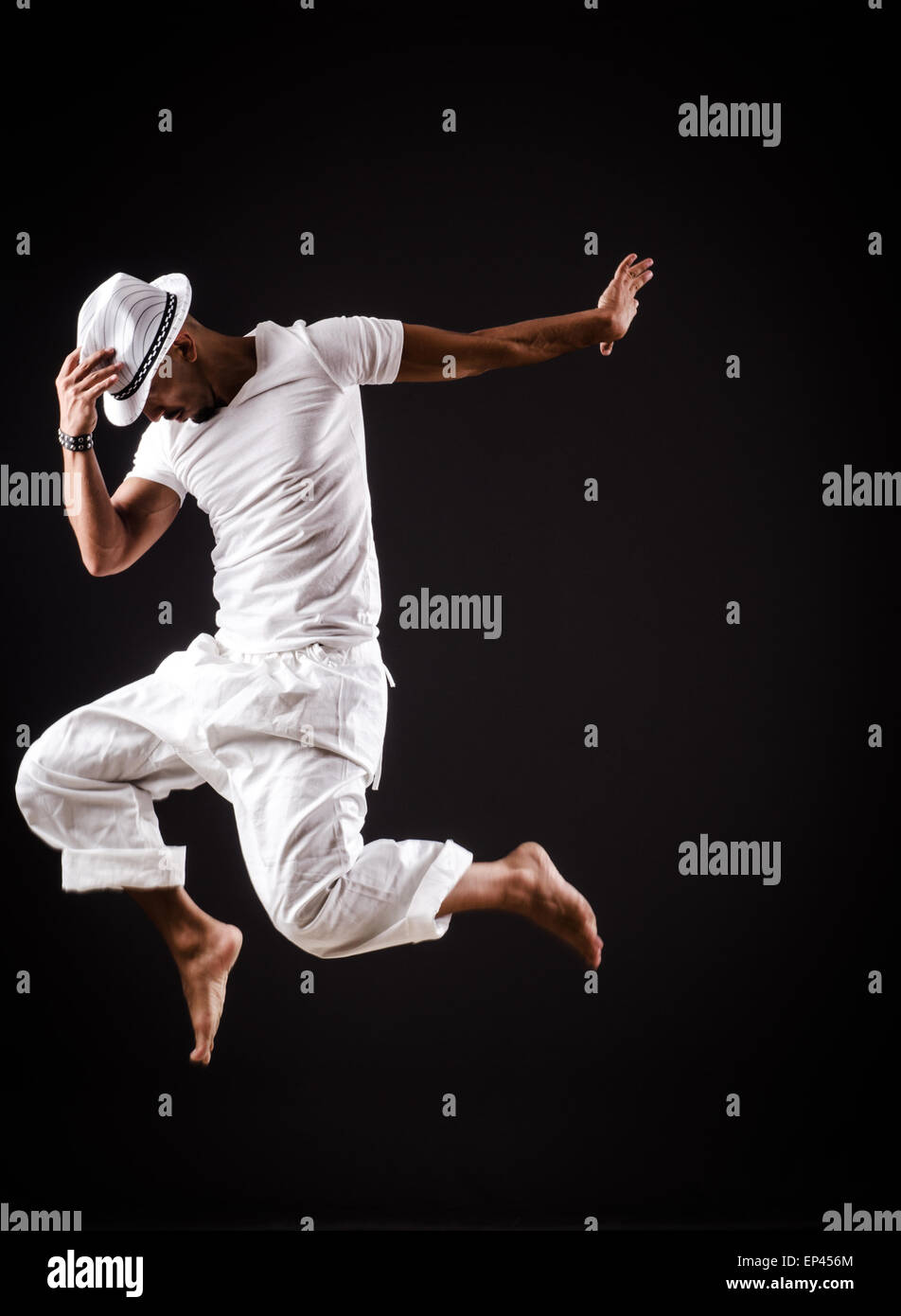 Dancer dancing dances in white clothing Stock Photo - Alamy