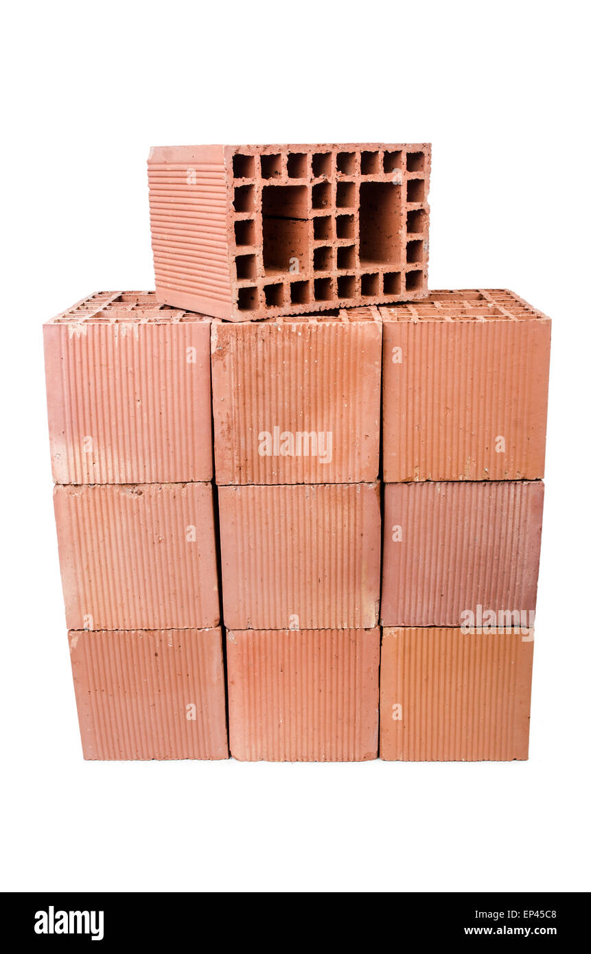 Stack of clay bricks isolated on white Stock Photo - Alamy
