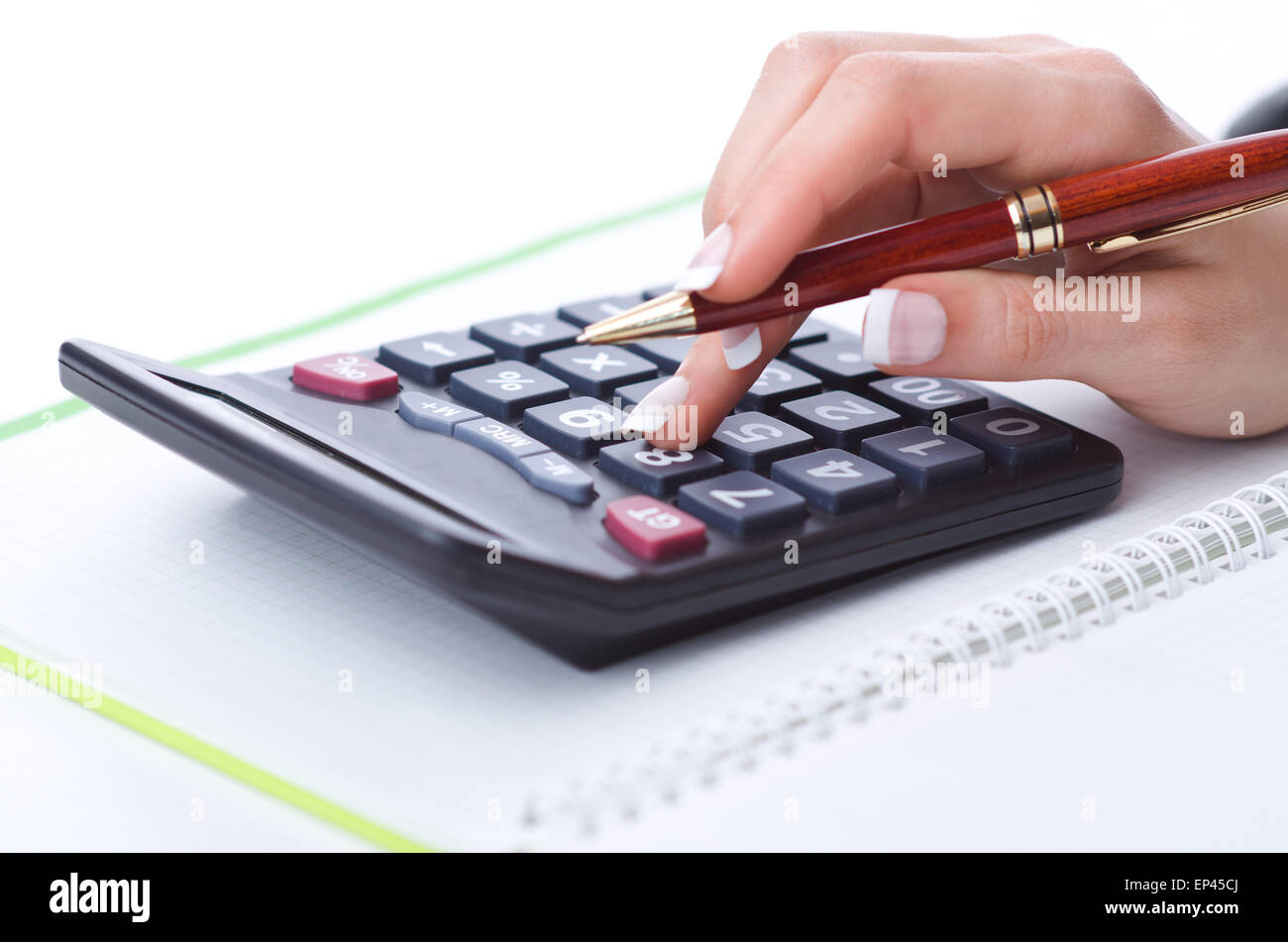 Hands working on the calculator Stock Photo - Alamy