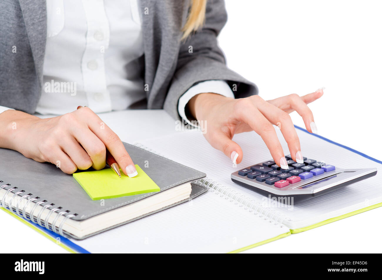 Hands working on the calculator Stock Photo - Alamy