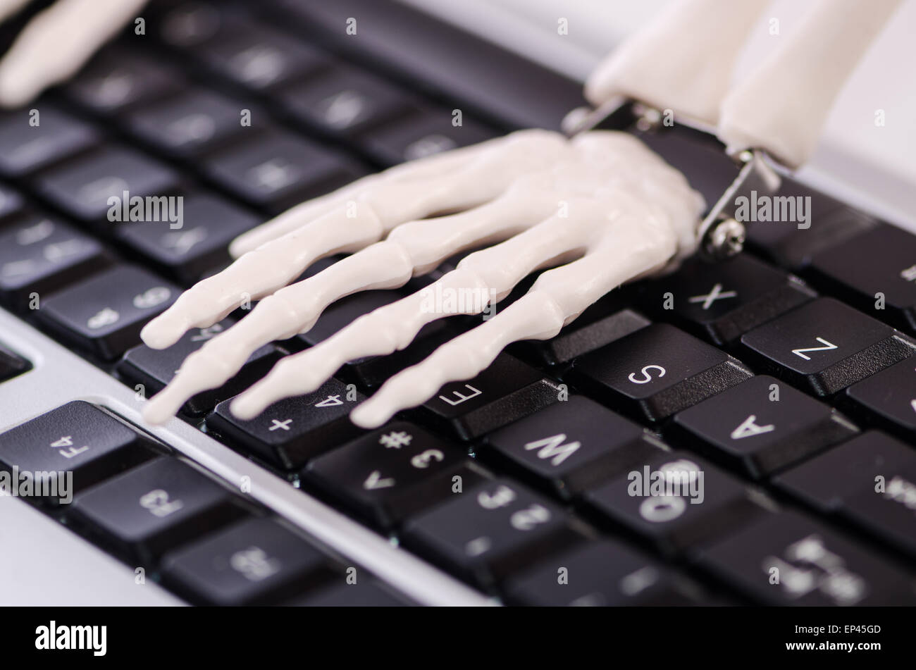 Skeleton working on the keyboard Stock Photo - Alamy