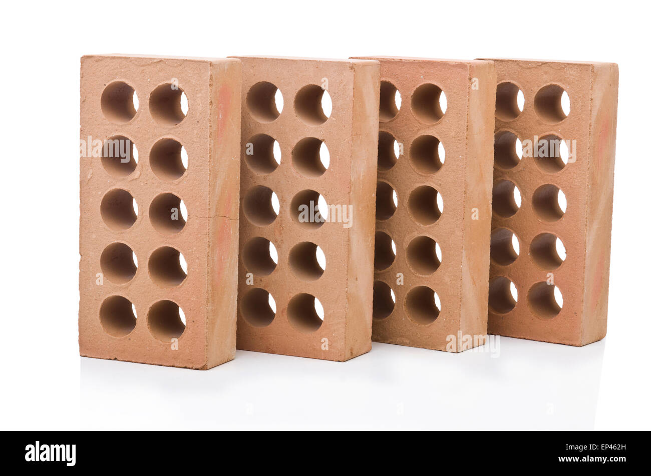 Stack of clay bricks isolated on white Stock Photo - Alamy