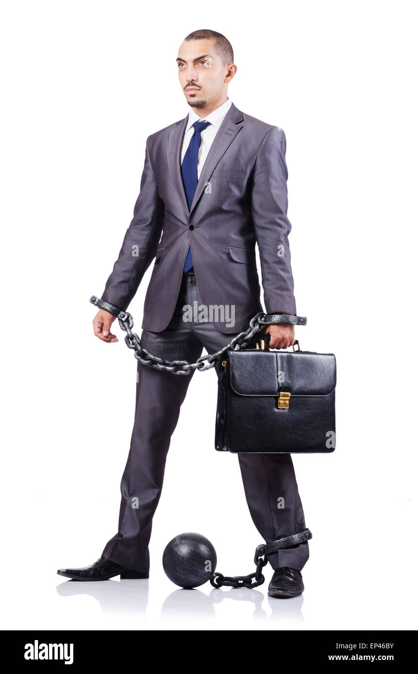 Businessman with shackles on white Stock Photo - Alamy