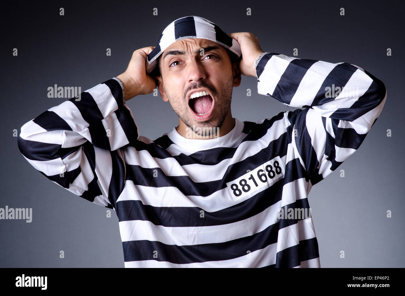 Convict criminal in striped uniform Stock Photo - Alamy