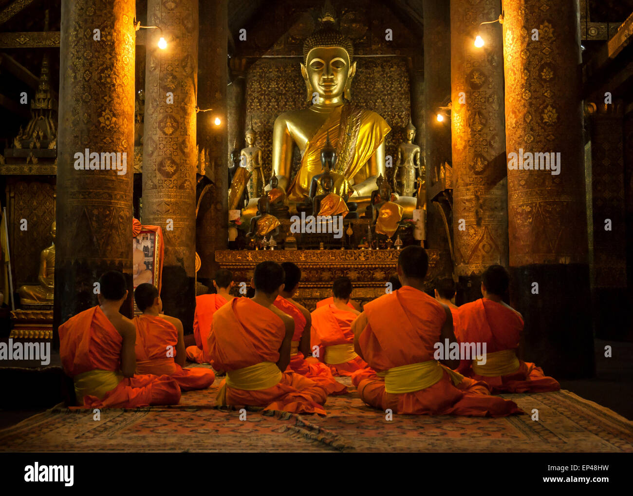 Monks praying in the temple Stock Photo - Alamy