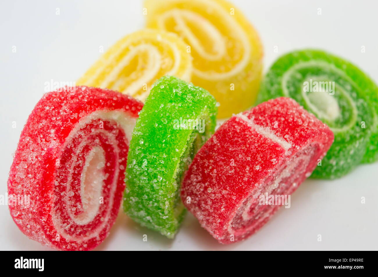Colorful jelly rolls on white Stock Photo - Alamy