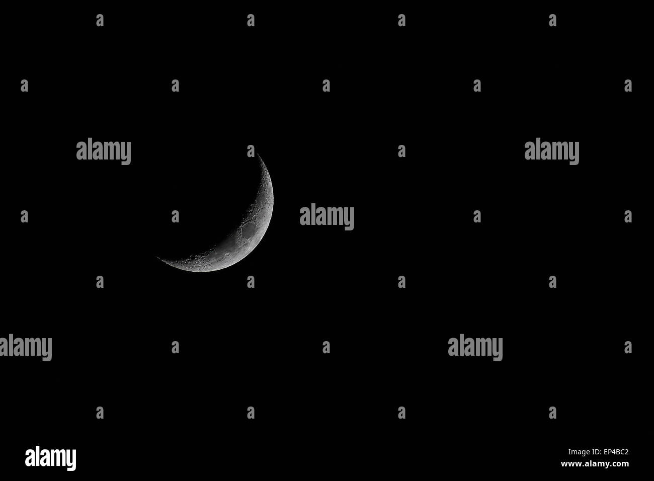 Thin slice of moon Stock Photo - Alamy
