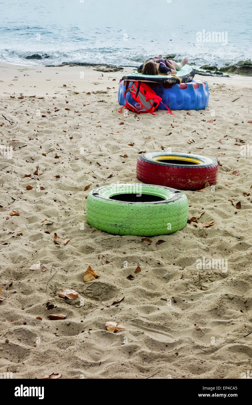 Woman lying sunbathing on beach hi-res stock photography and images - Alamy
