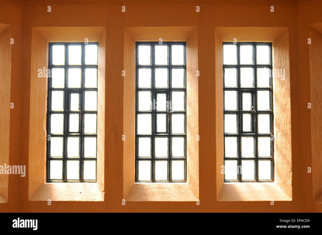Abstract view of symmetrical windows on colorful wall Stock Photo - Alamy
