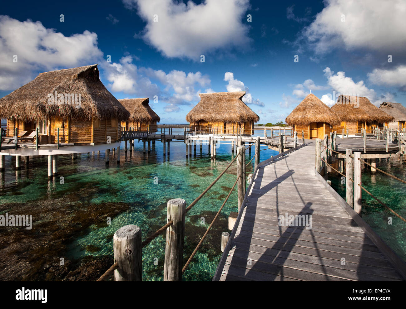Typical Polynesian landscape -small houses on water Stock Photo - Alamy