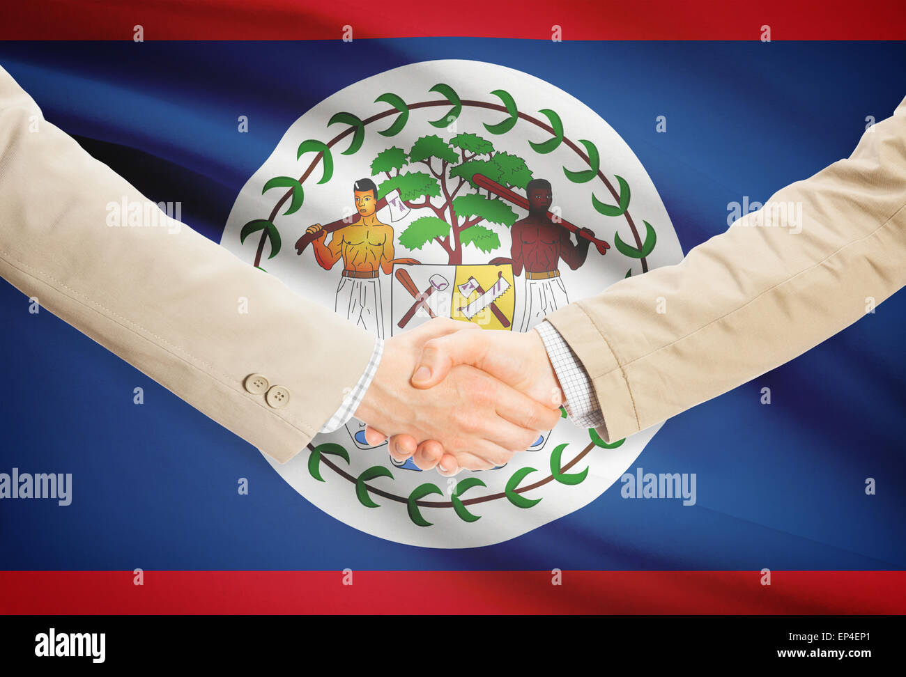 Businessmen shaking hands with flag on background - Belize Stock Photo ...