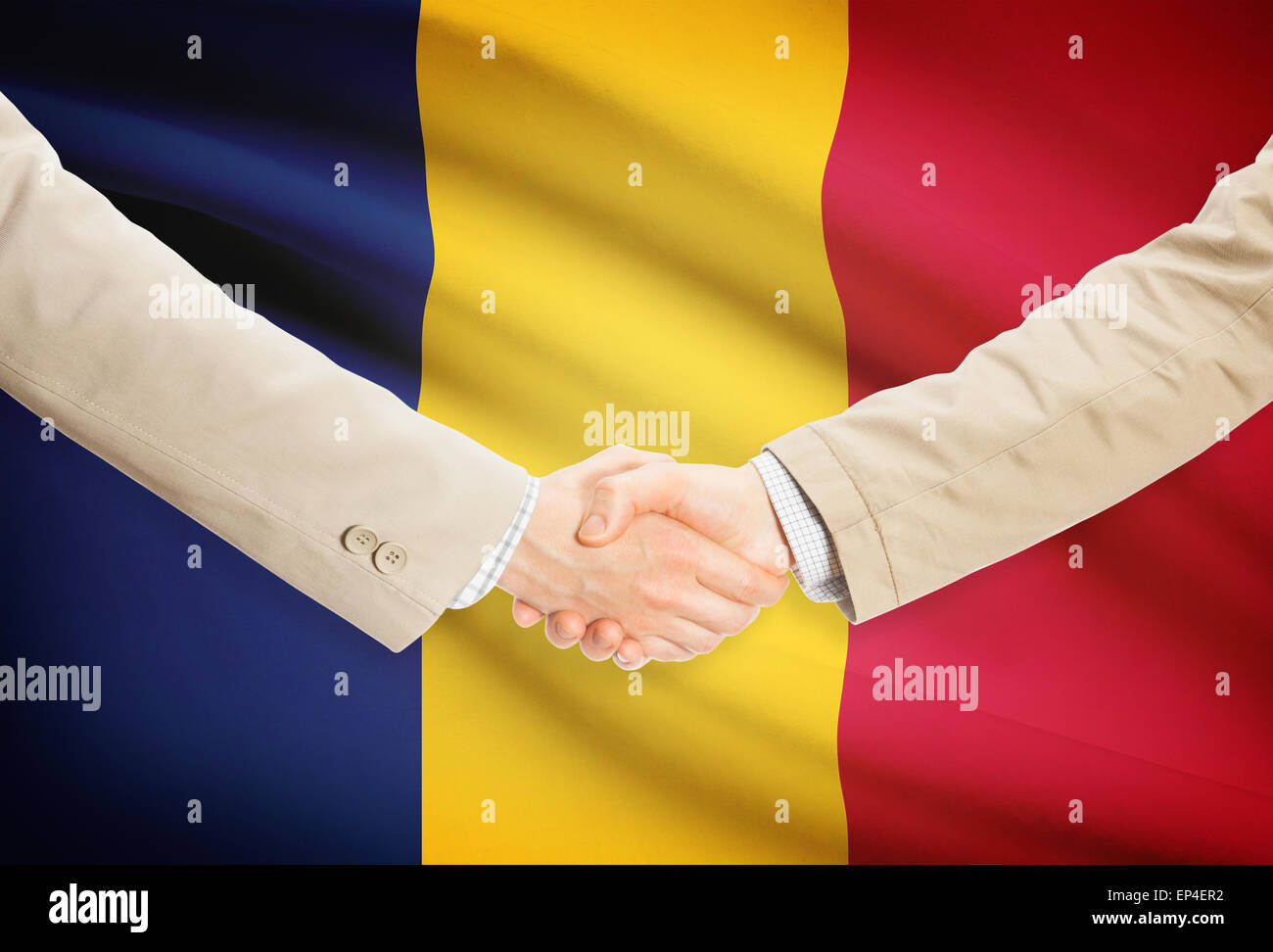 Businessmen shaking hands with flag on background - Chad Stock Photo ...
