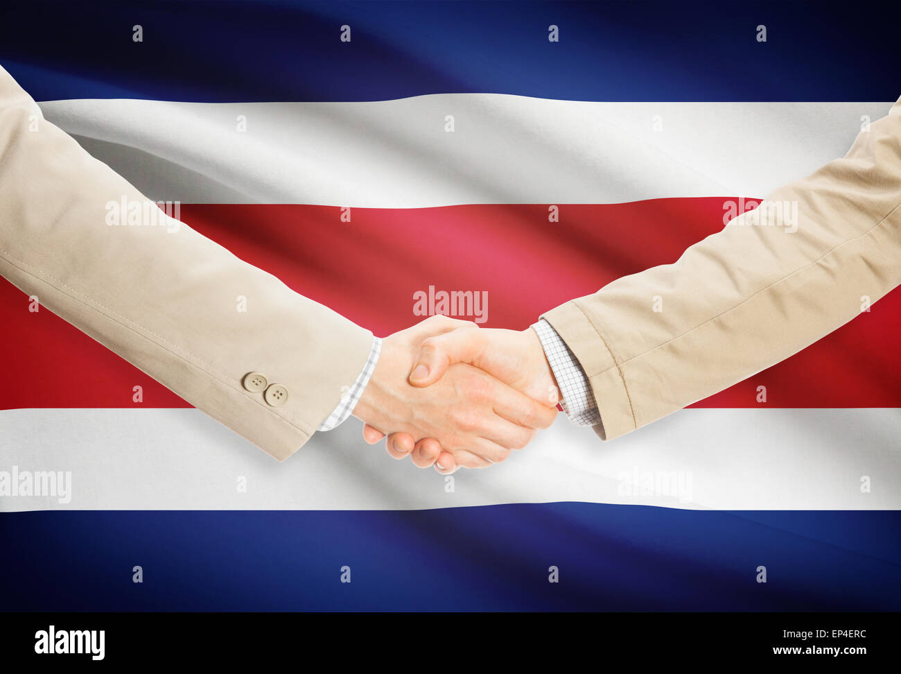 Businessmen shaking hands with flag on background - Costa Rica Stock ...